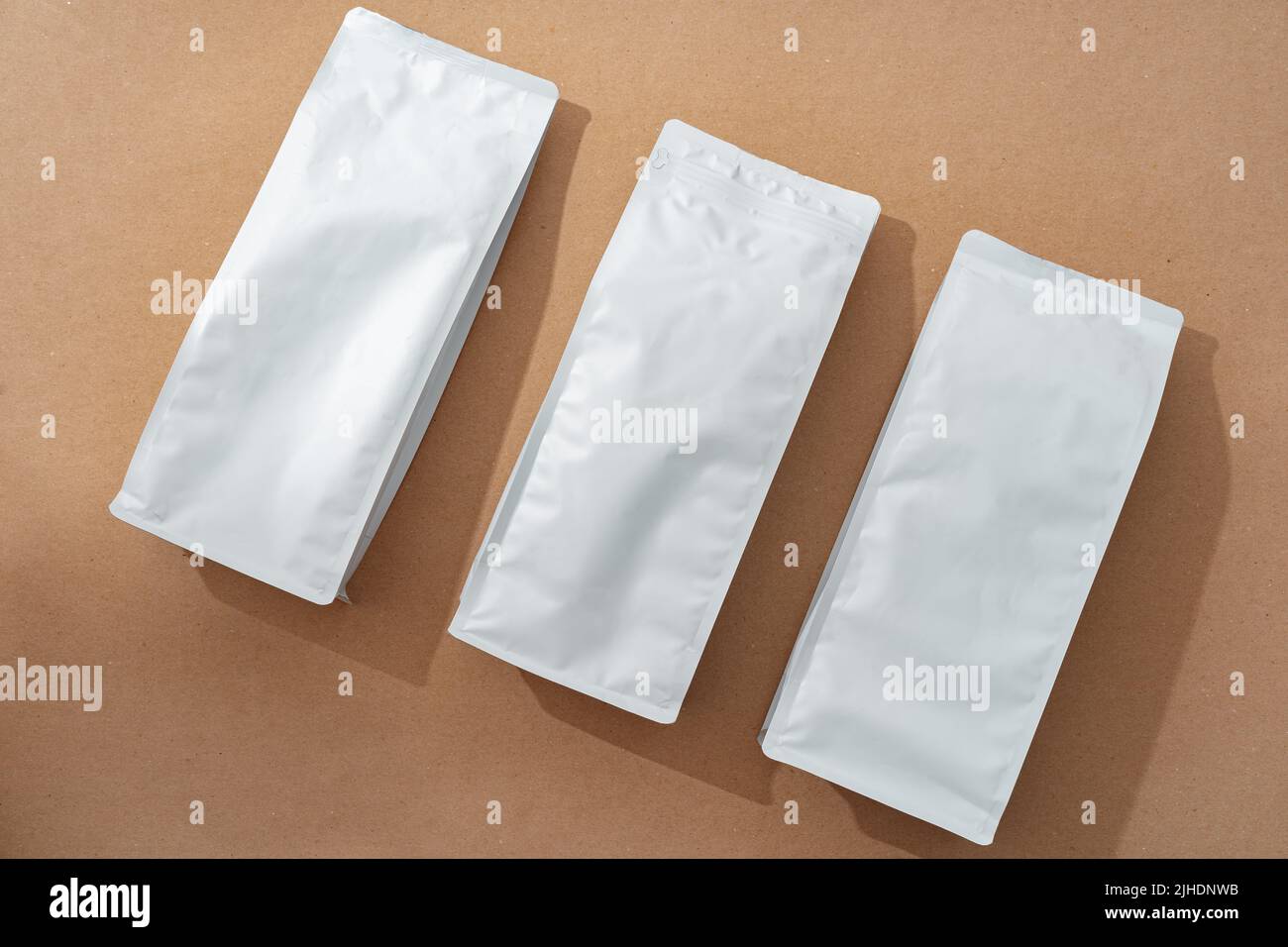 White blank matte coffee package on paper background Stock Photo - Alamy