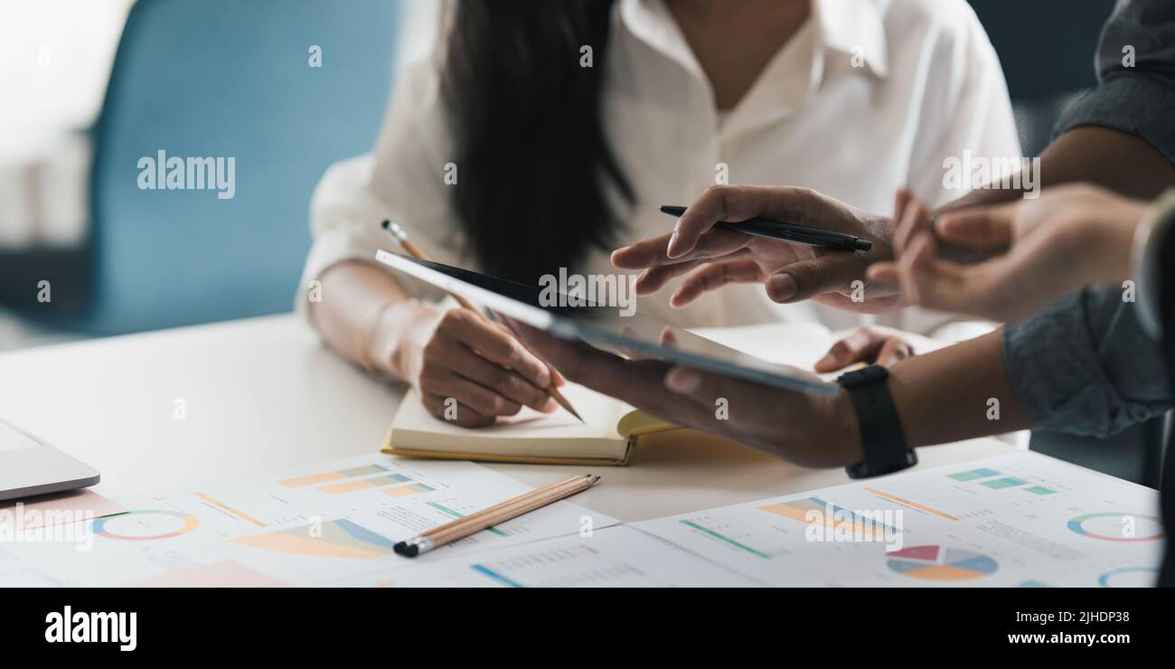 Group of Businesswoman and Accountant checking data document for ...