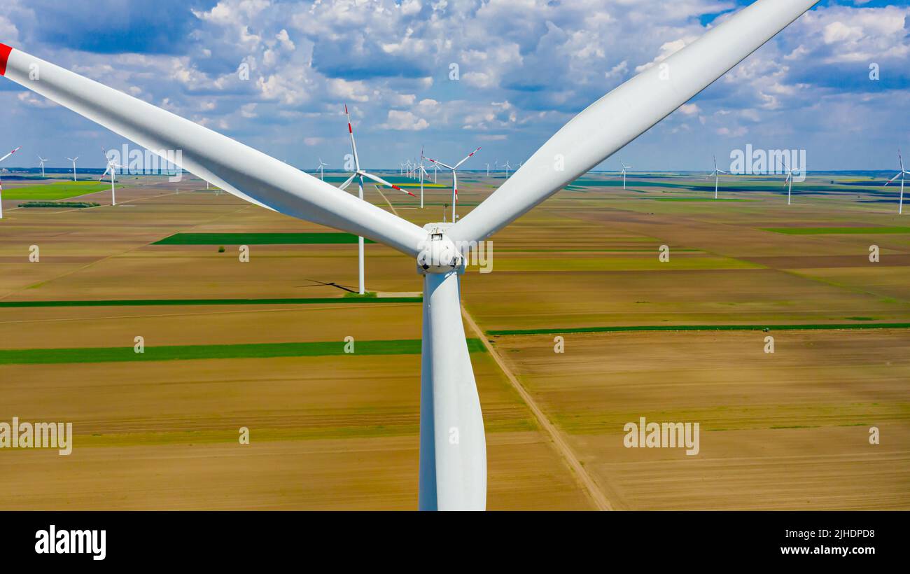 Close-up in aerial view at large propeller of windmill, wind generator ...