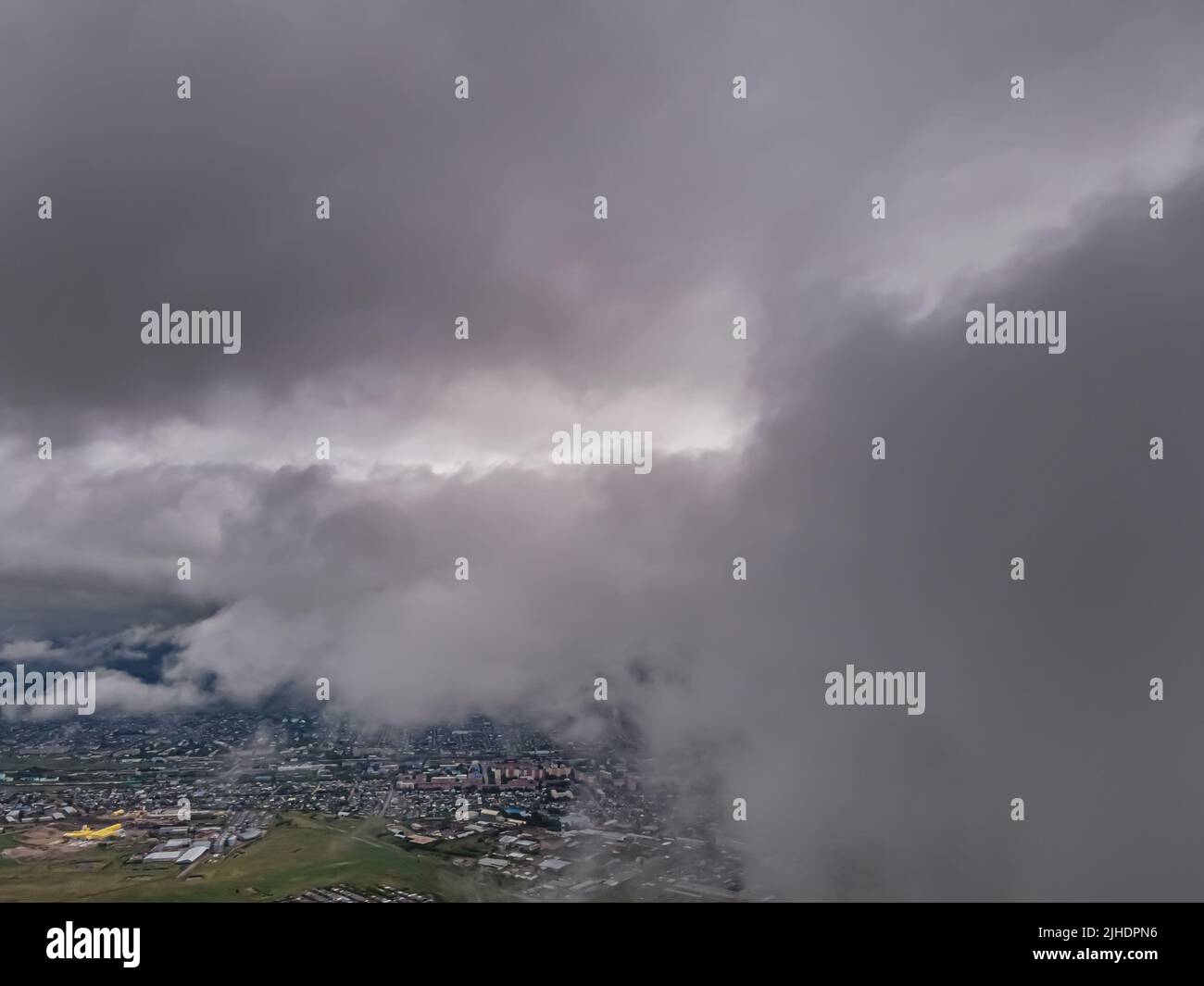 Flying through thick clouds. Rain clouds in the sky. Cumulus clouds ...