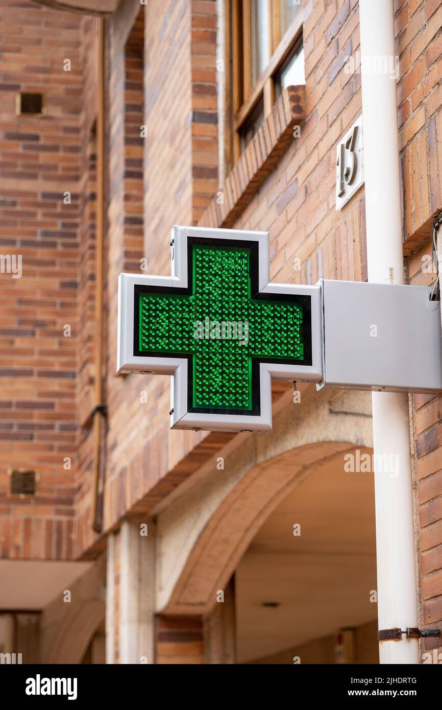 Hospital sign. Emergency help symbol. Illuminated signboard. Urban ...