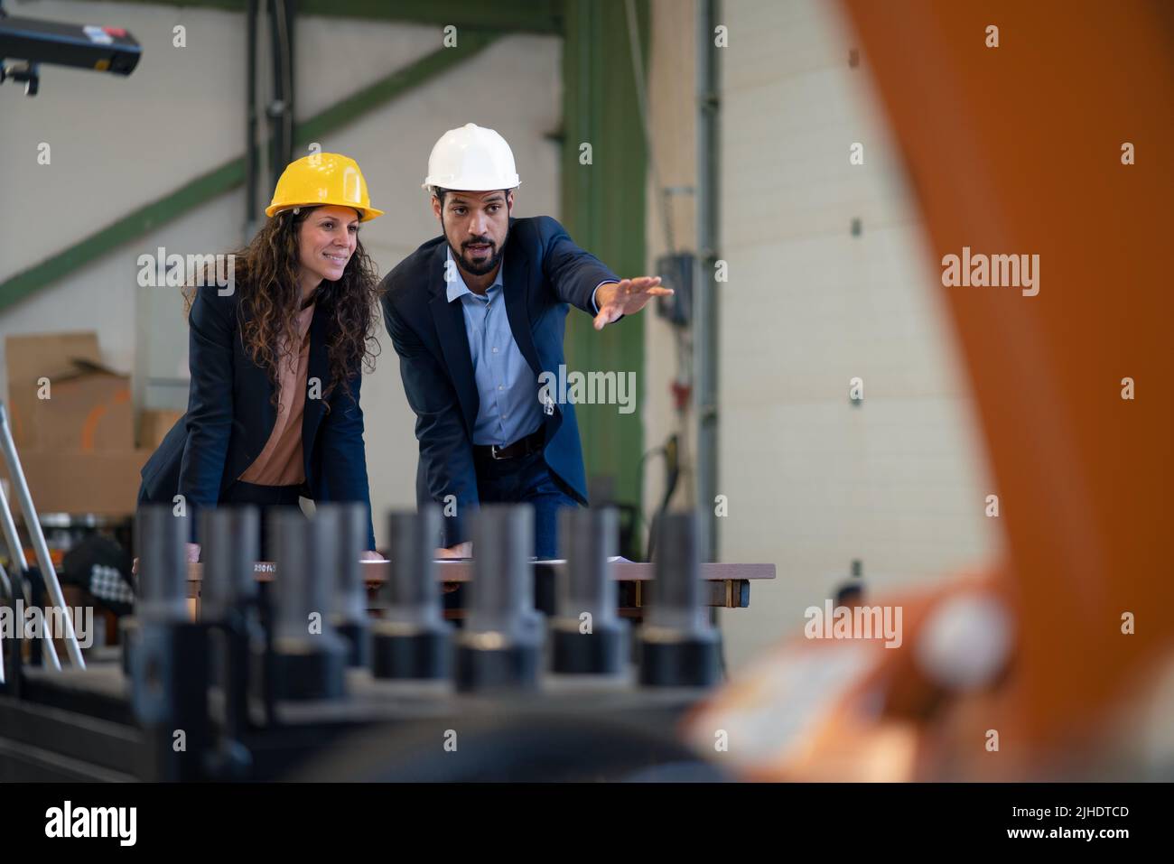 Chief engineer and project manager in modern industrial factory with ...