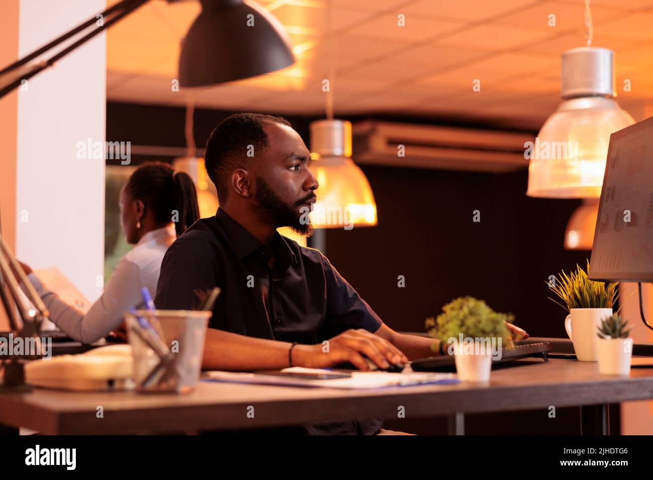 Project manager working on business charts research with computer ...