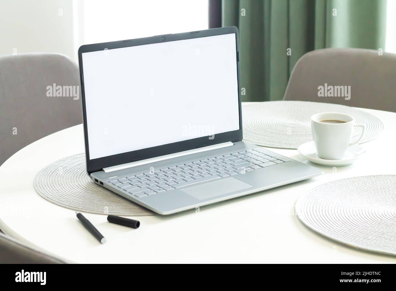 Open laptop computer with blank white monitor screen mockup. Home ...