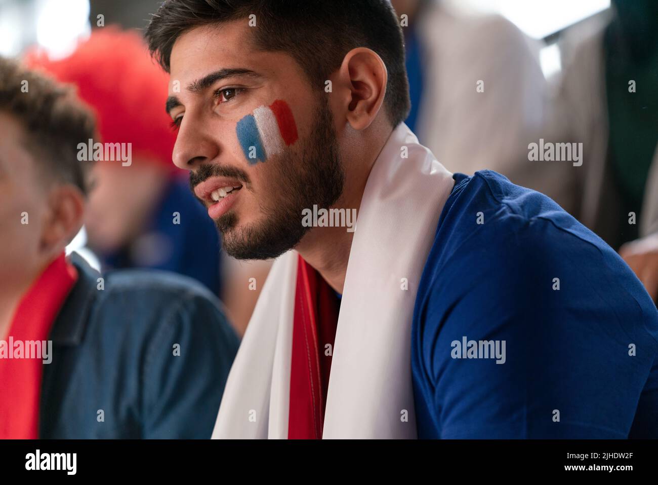 Worried football fans supporting French national team in live soccer ...