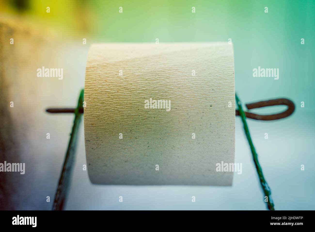 Toilet paper holder with cheap low quality single ply toilet paper ...