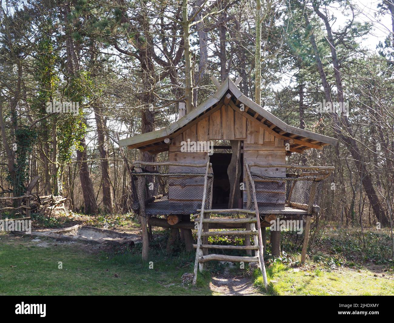 A small children's wooden house in the natural playground Stock Photo ...