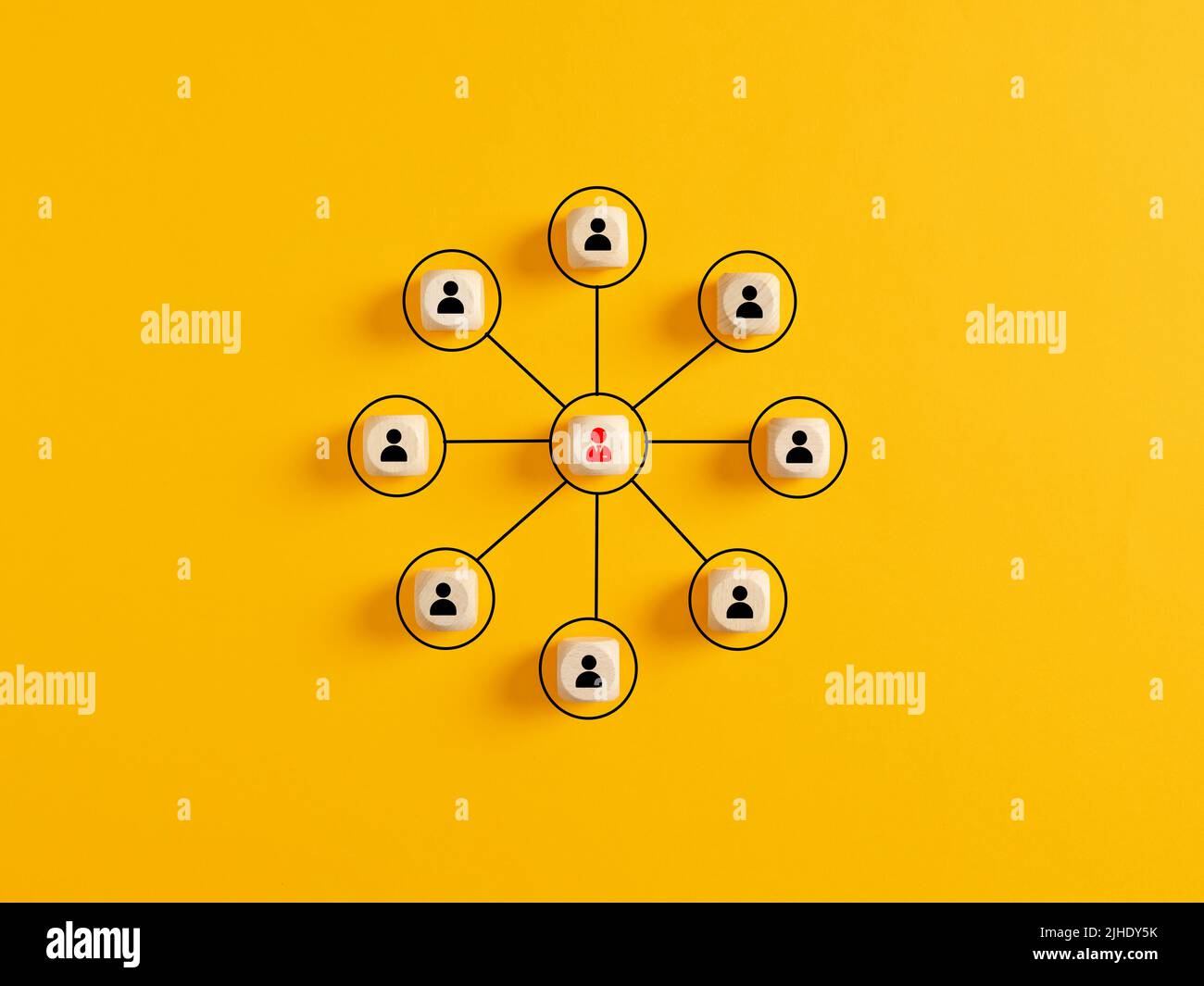 Company organizational chart of wooden cubes on yellow background ...