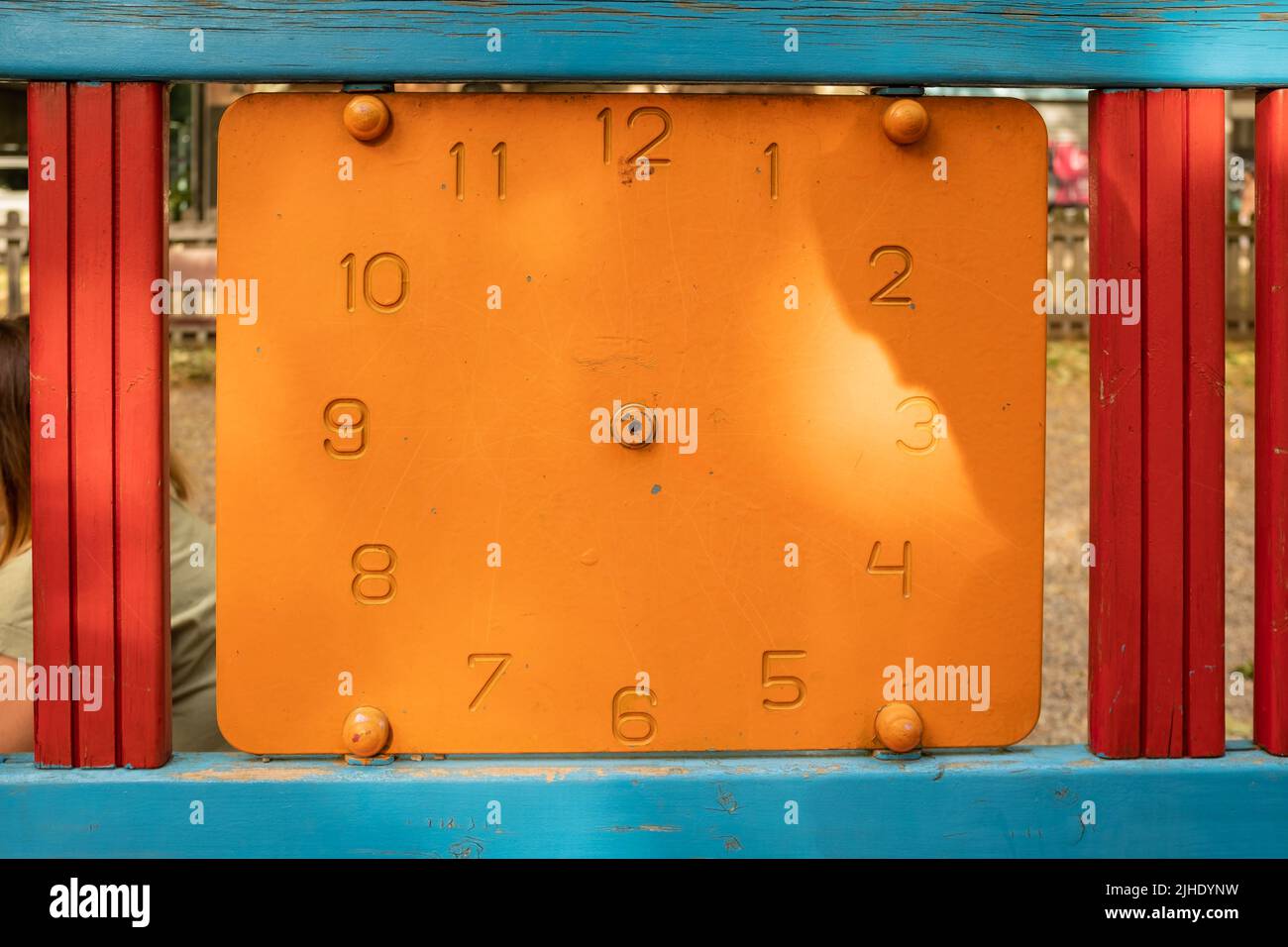 Orange clock written on a wood on an outdoor park Stock Photo - Alamy