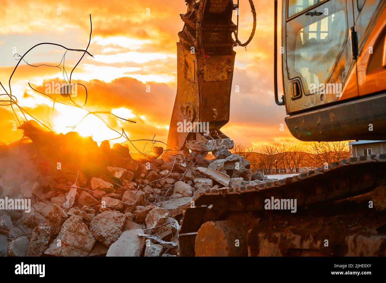 Excavator with concrete crusher on rig at demolition site Stock Photo ...