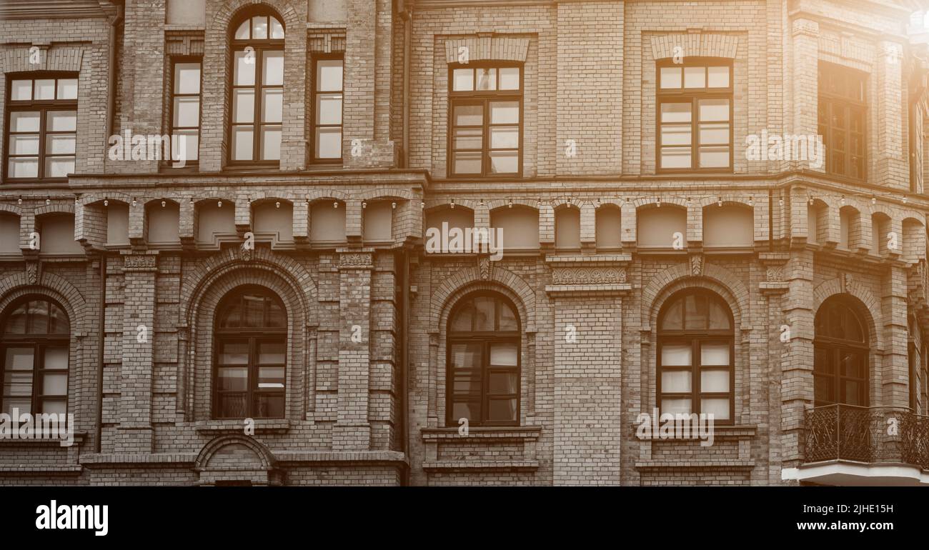 old brick house with windows. vintage architecture in English style ...