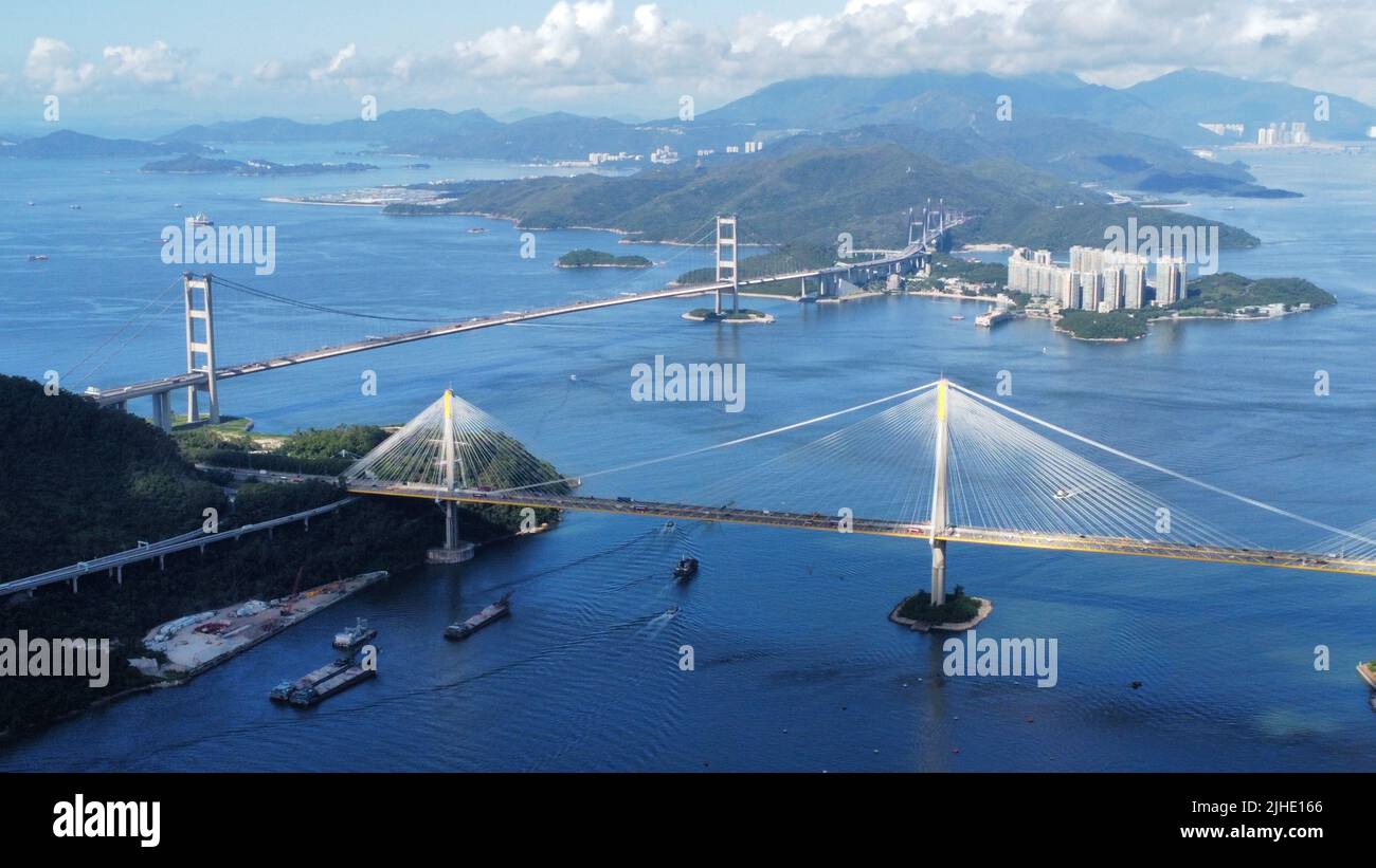 An aerial view of Tsing Ma Bridge in Hong Kong surrounded by the water ...
