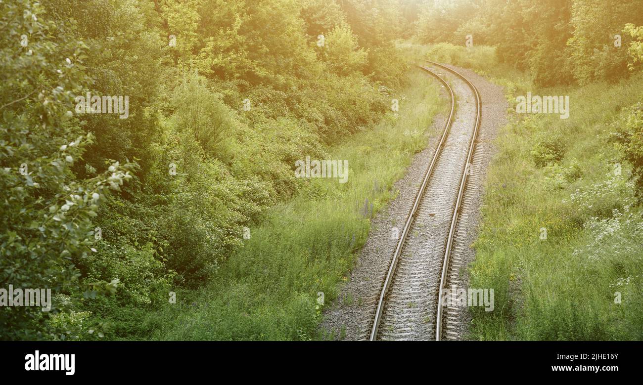 Railway infrastructure. Rail tracks in the green field. cargo delivery ...
