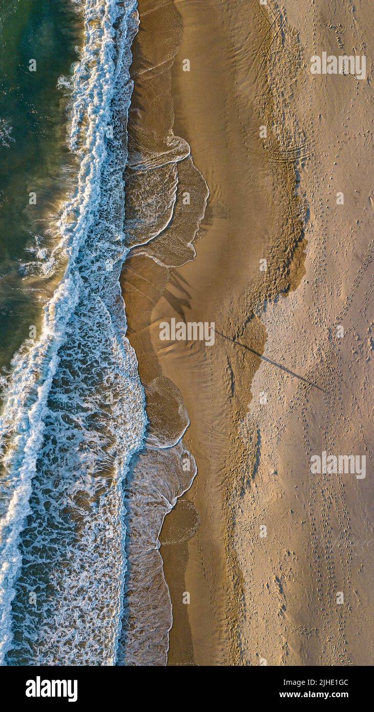 A aerial drone top view of a surfer's paradise and the main beach of ...