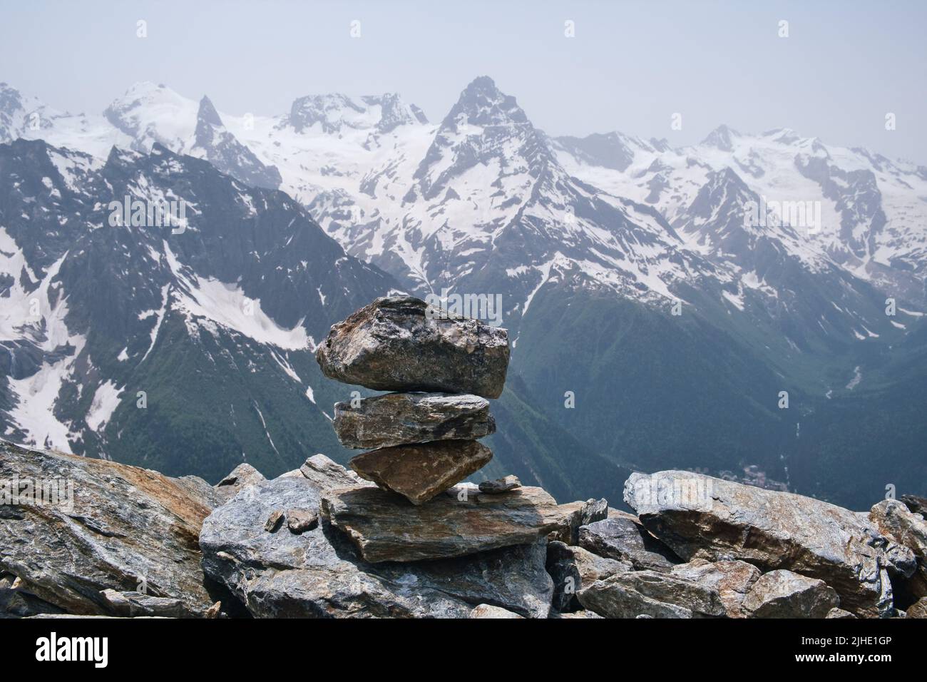 Stack of stones on top of the mountain against a background of mountain ...