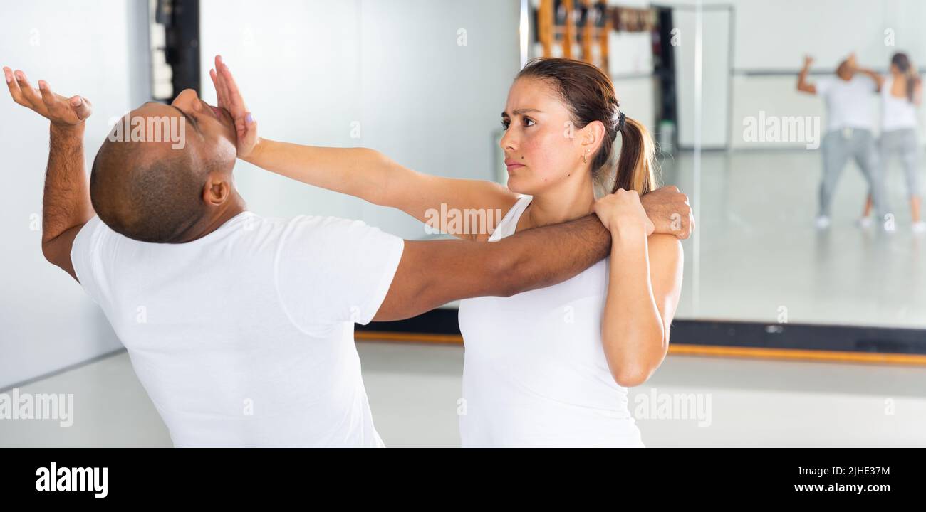 Active woman with professional trainer are training captures on the ...