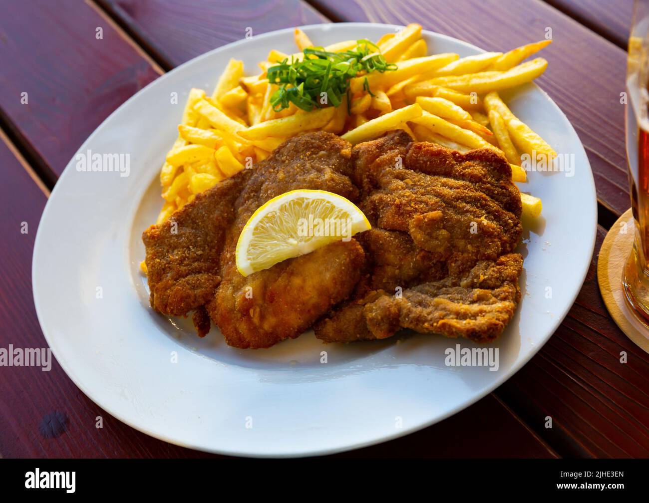 Cooked fried pork meat chops with fried potato Stock Photo - Alamy
