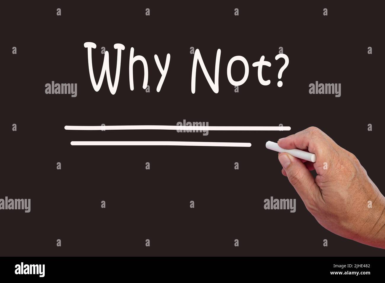 Male hand writes in white chalk pencil the word Why Not with question ...