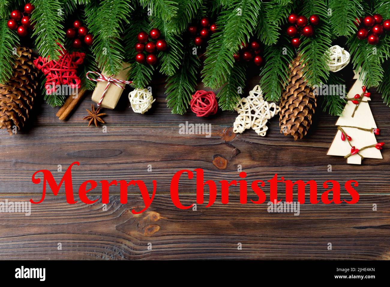 Merry Christmas text. Top view of frame made of fir tree branches and ...