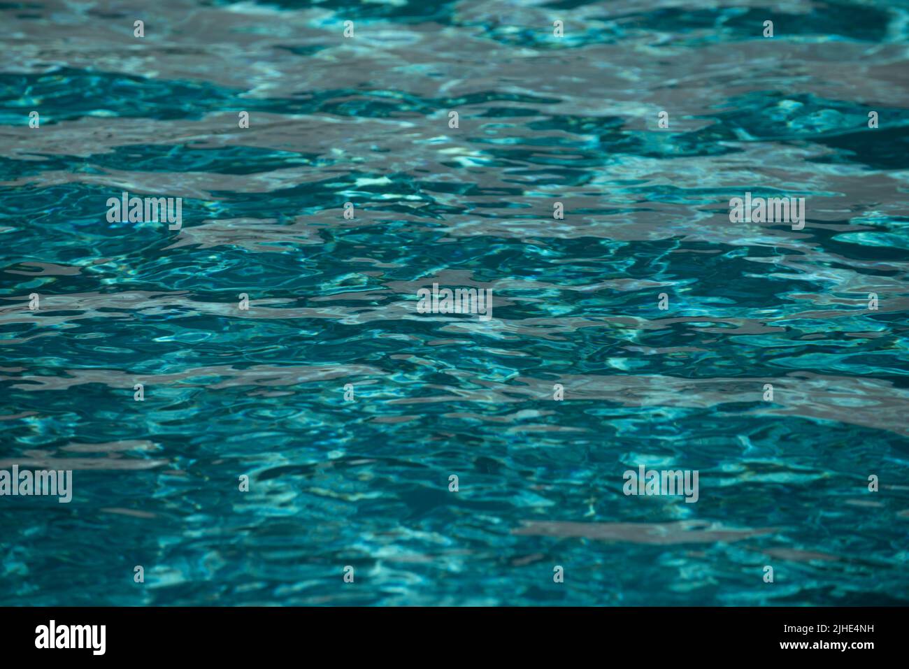 Abstract ripple wave and clear turquoise water surface in swimming pool ...