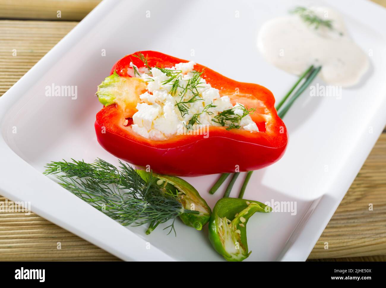 Photography of plate with pepper stuffed with brynza Stock Photo - Alamy