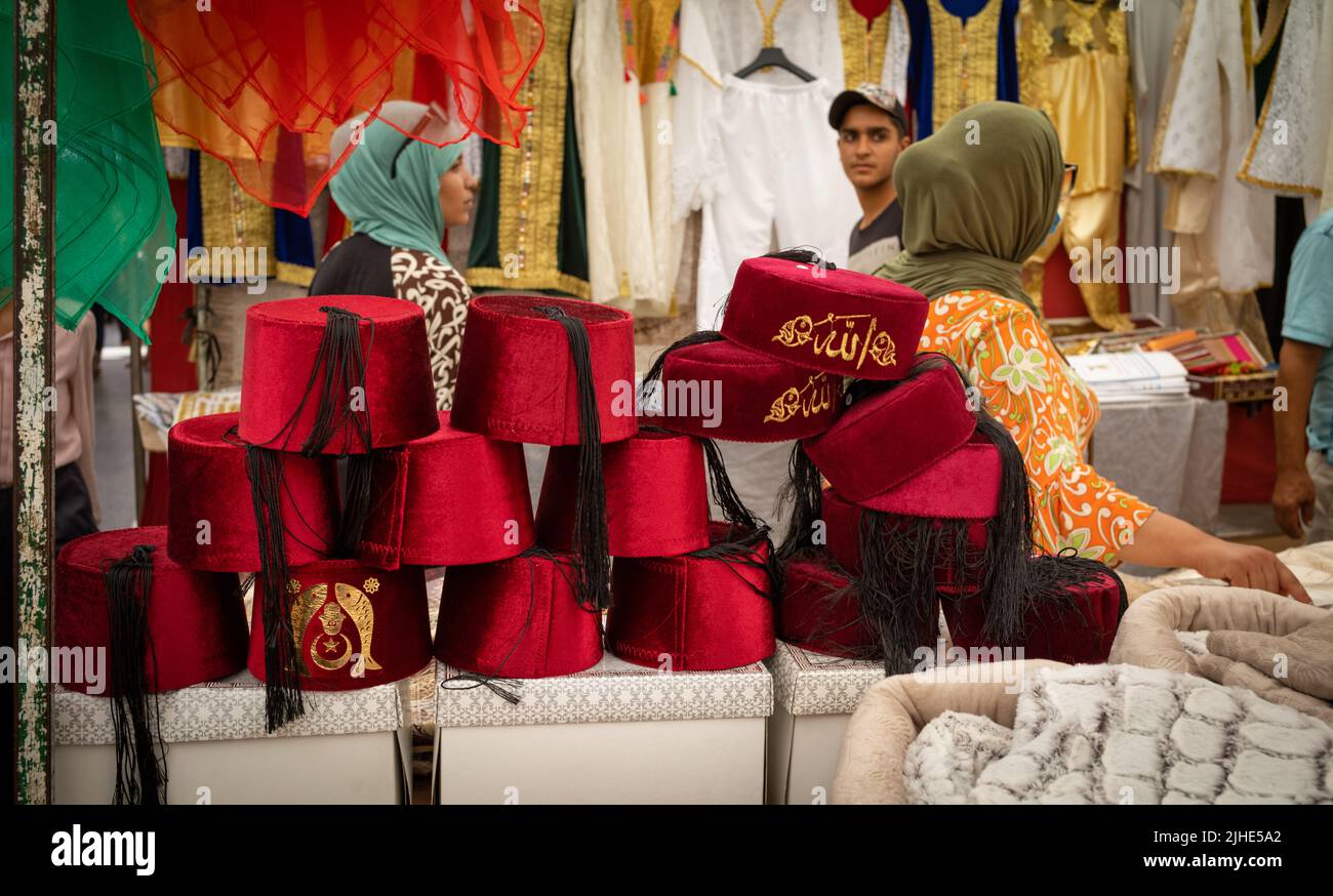 Traditional fez hats for sale in the Sunday Souk, a weeking market in ...