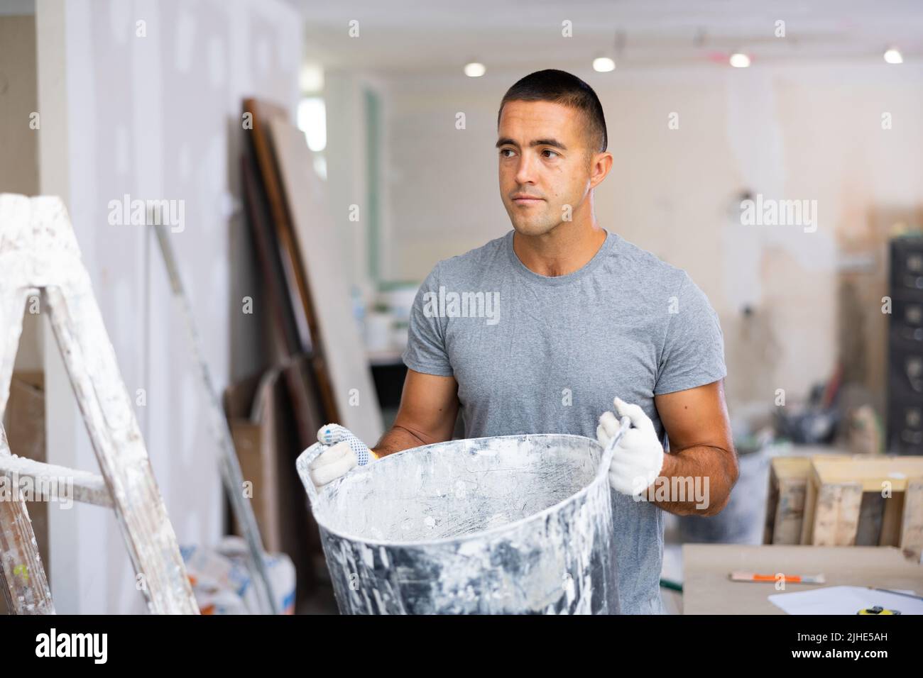 Portrait of a young man in the process of repair Stock Photo - Alamy