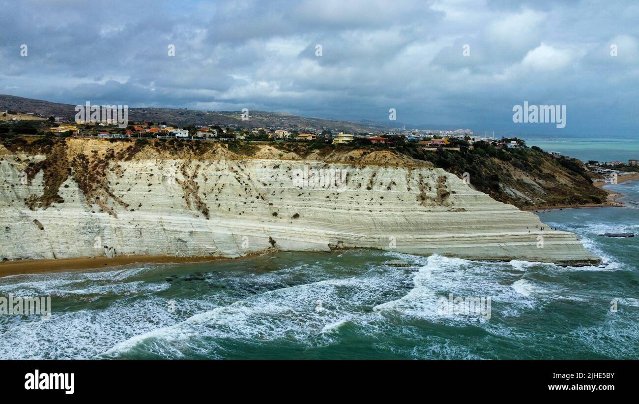 A beautiful view of the Stair of the Turks cliffs by water in Agrigento ...