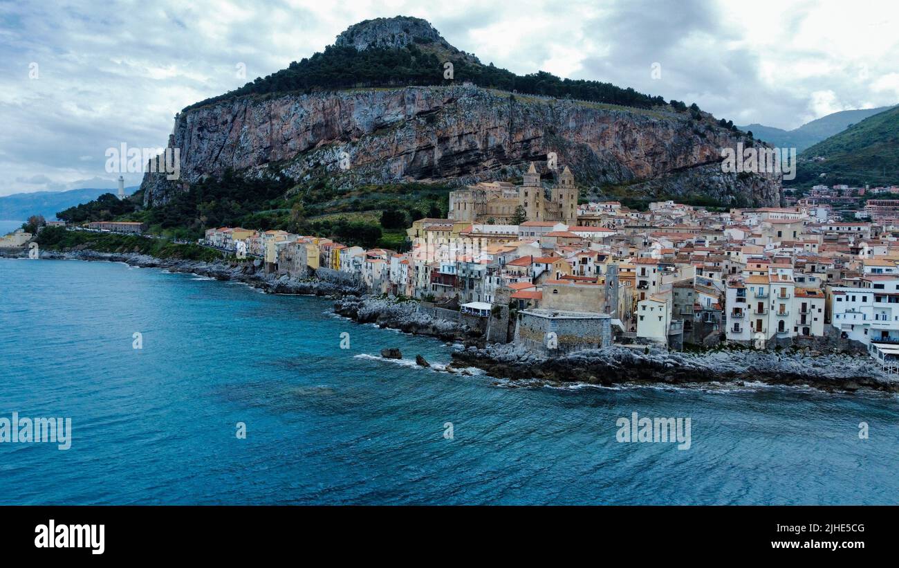 A bird's eye view of the seascape and the skyline of Cefalu city ...
