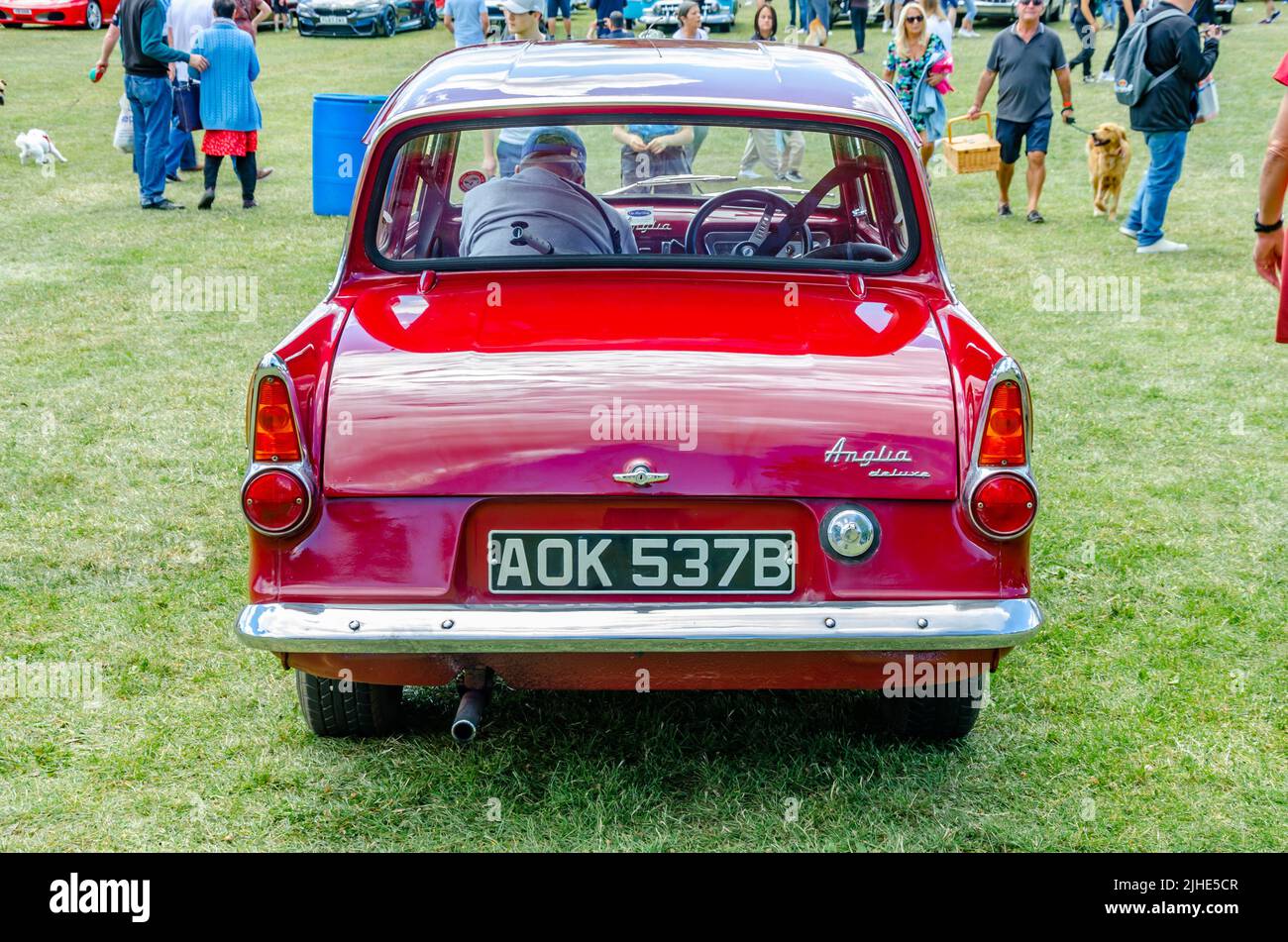 Rear view of a 1964 Ford Anglia classic car in red at The Berkshire ...