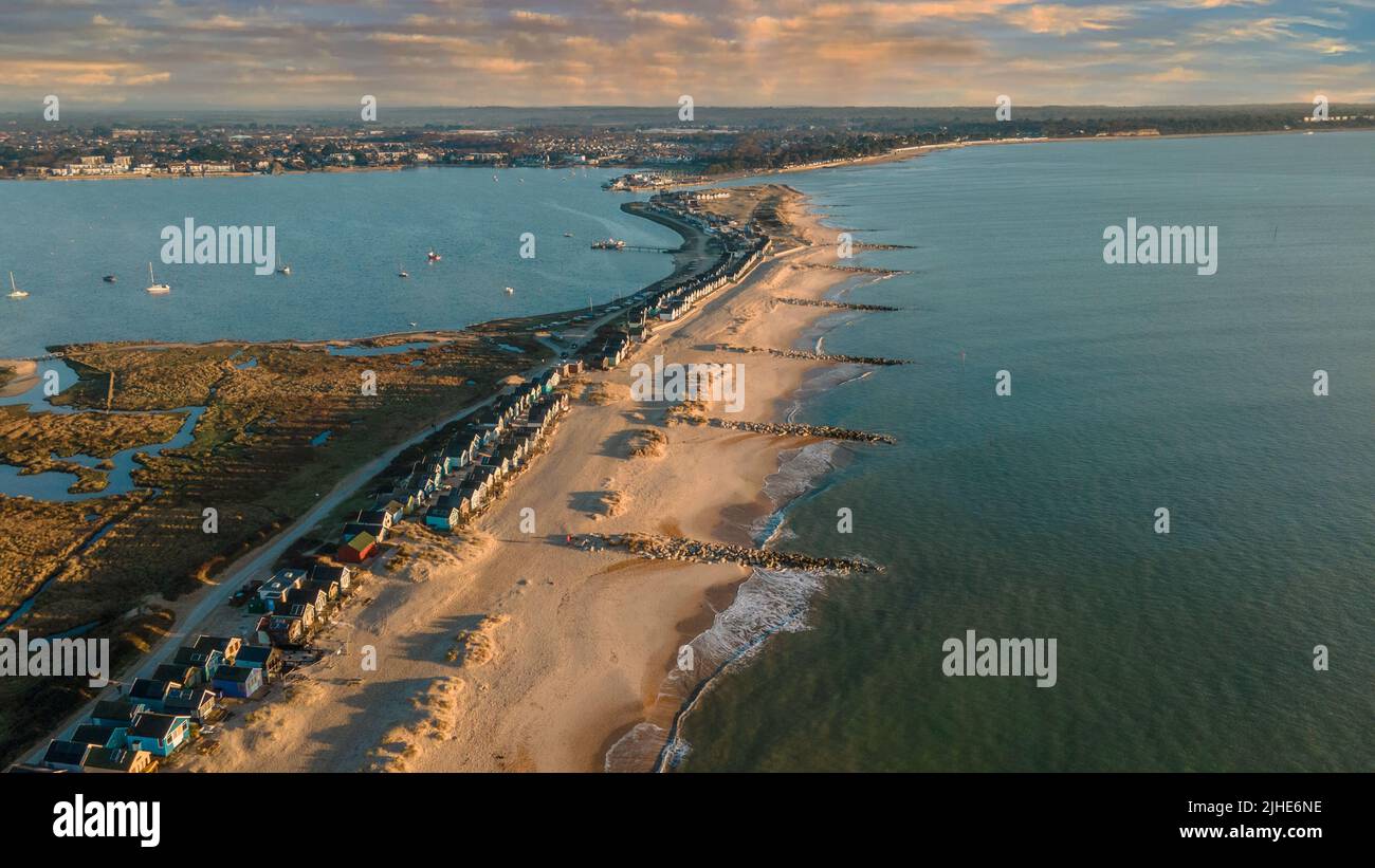 A mesmerizing bird's eye view of a coastline during sunrise over ...
