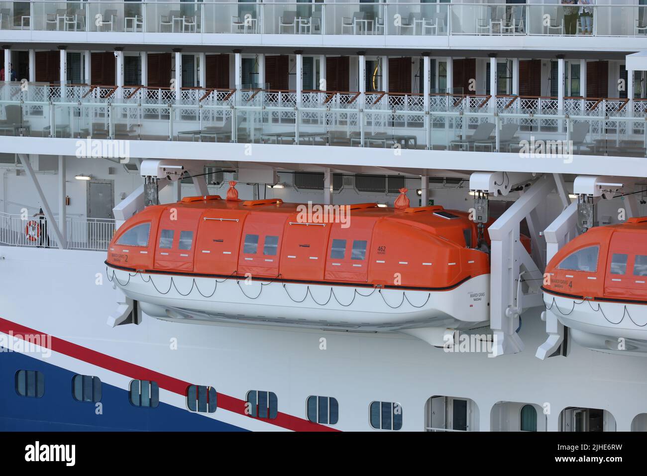 Lifeboats hanging over deck on cruise ship Stock Photo - Alamy