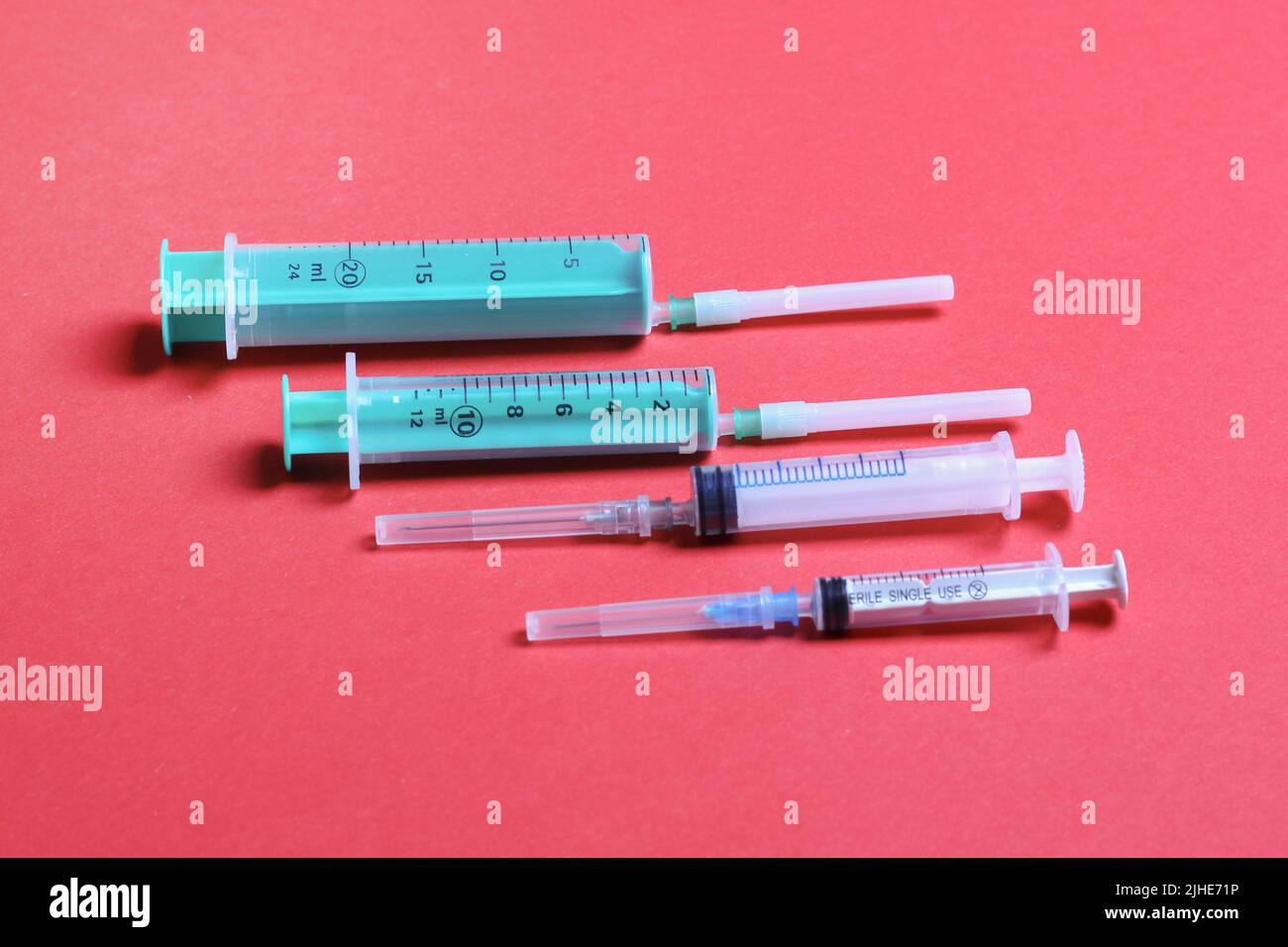 Top view of medical syringes on colorful background. Health care ...