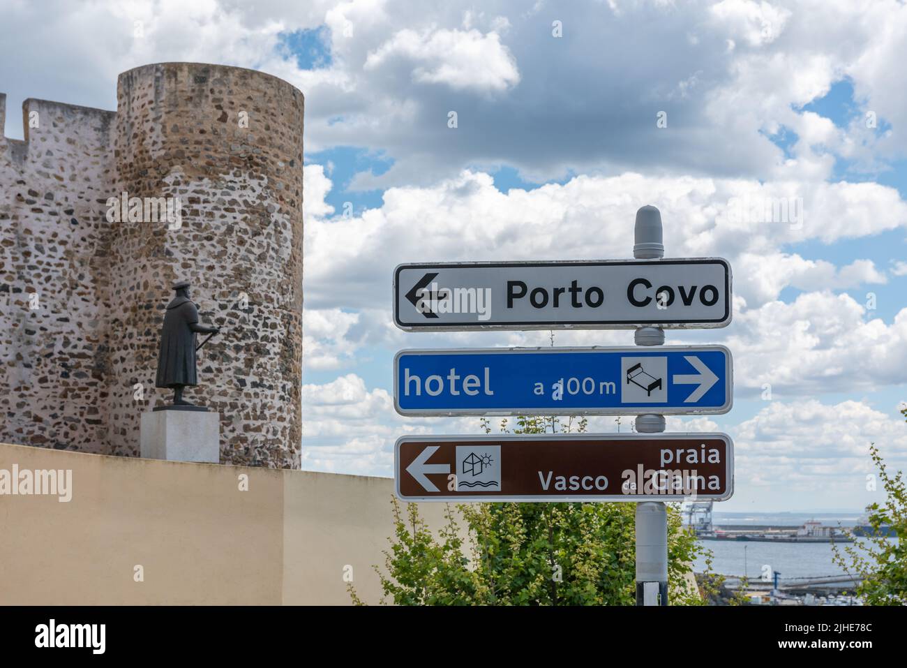 The view of street direction signs and Vasco da Gama statue against the ... The view of street direction signs and Vasco da Gama statue against the ...