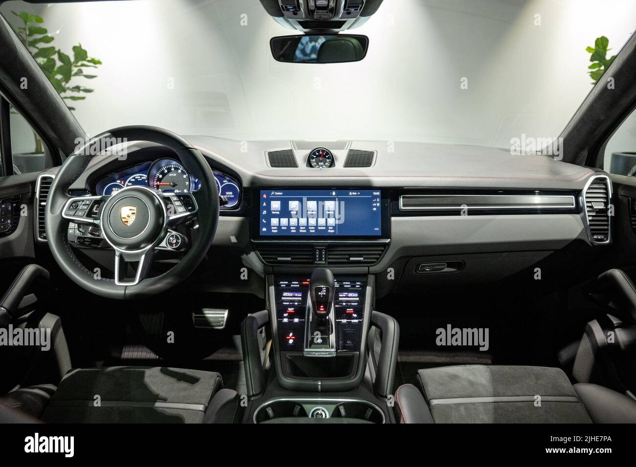 An interior of a black modern Porsche car with a screen device Stock ...