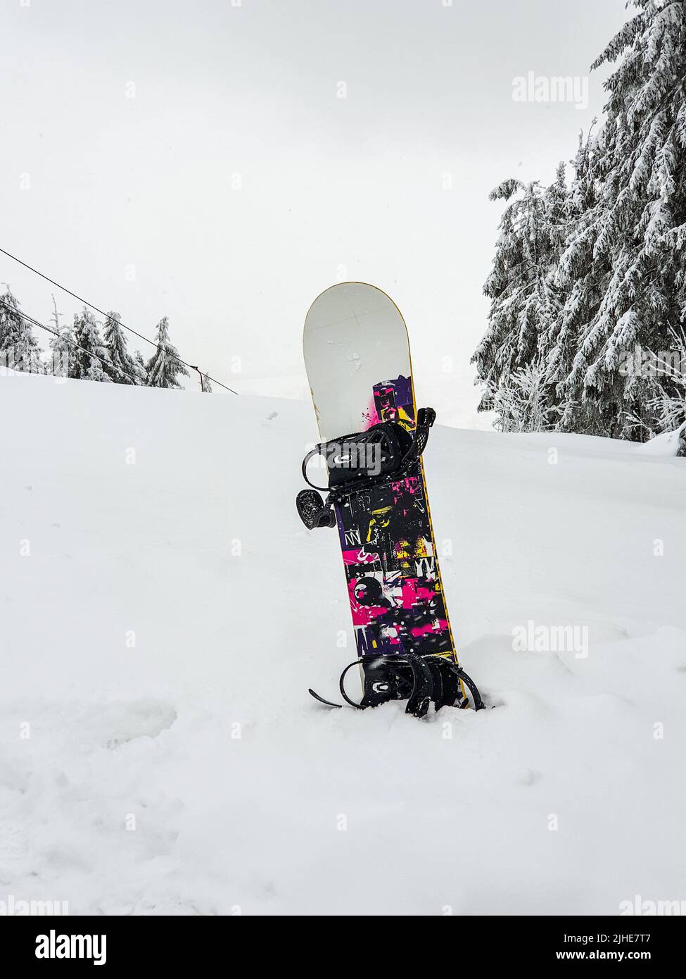 snowboard stick out from the snow Stock Photo - Alamy