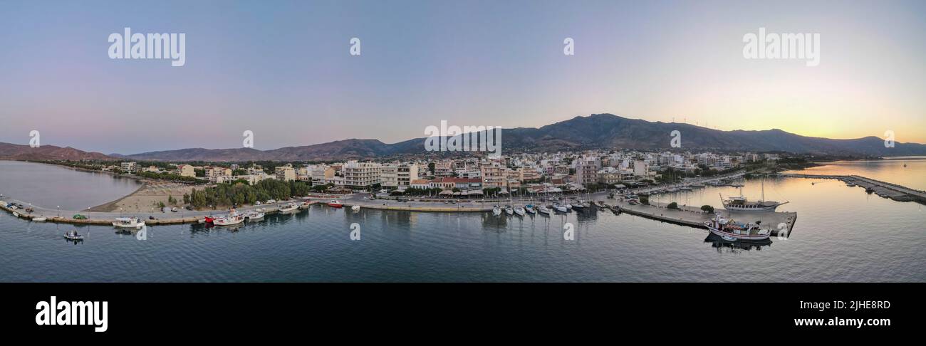 A panoramic view of a coastal cityscape and port, ships and yachts ...