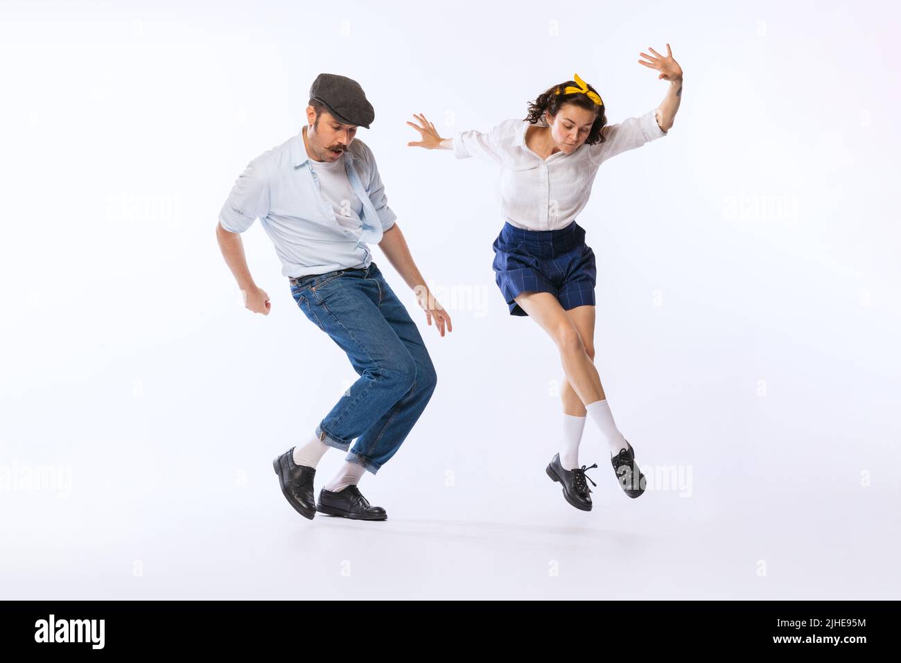 Portrait of young beautiful couple, man and woman, dancing boogie ...
