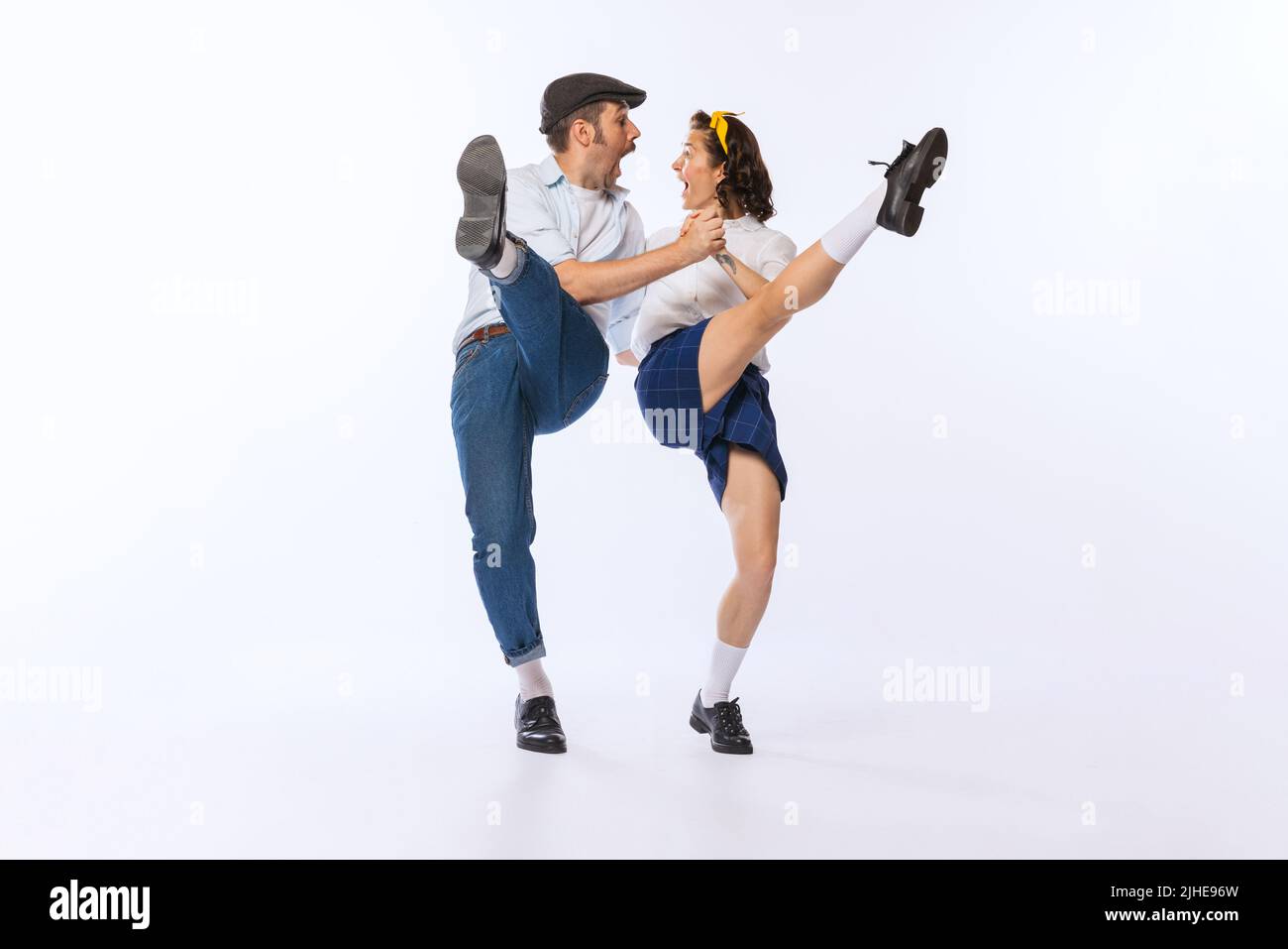 Portrait of young emotive couple, man and woman, dancing boogie woogie ...