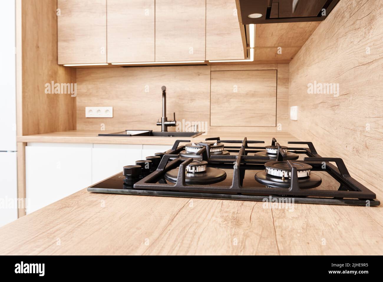 New kitchen stove with gas hob, close up. Modern kitchen appliance ...