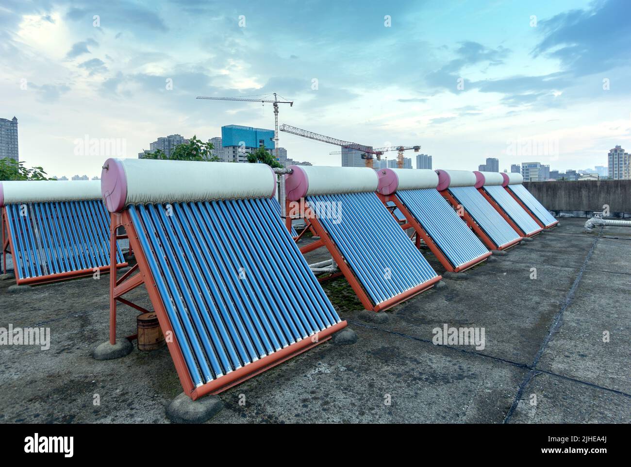 Solar water heater installed on a roof Stock Photo - Alamy