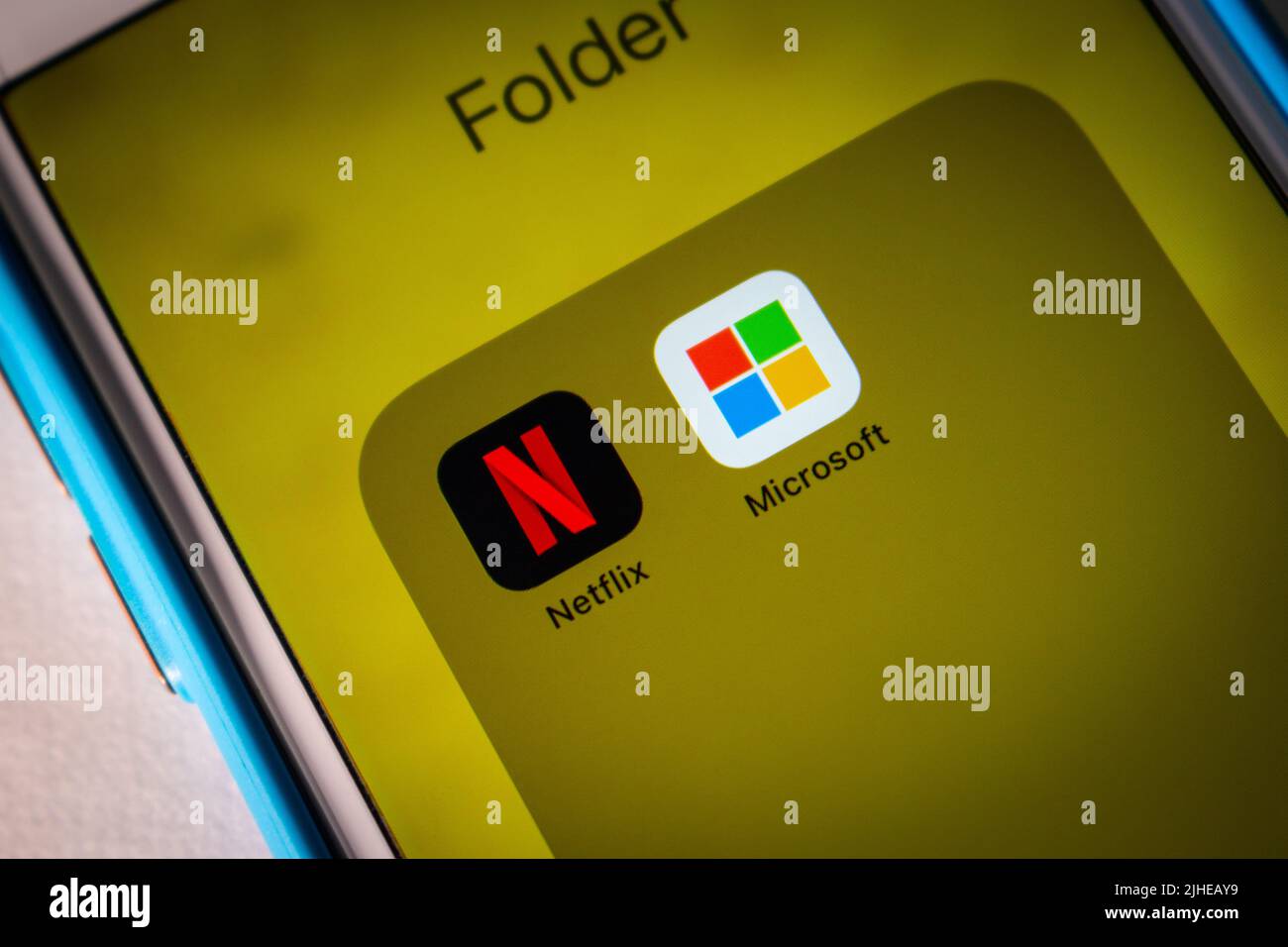 Netflix and Microsoft icons on an iPhone in a dark mood. In July 2022 ...