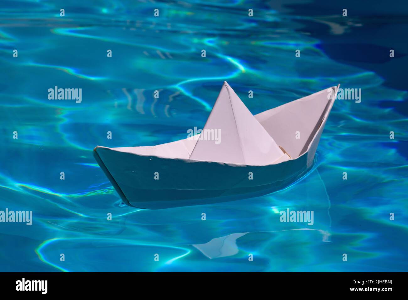 Paper ship , origami paper ship sail. Paper boat on the sea water ...