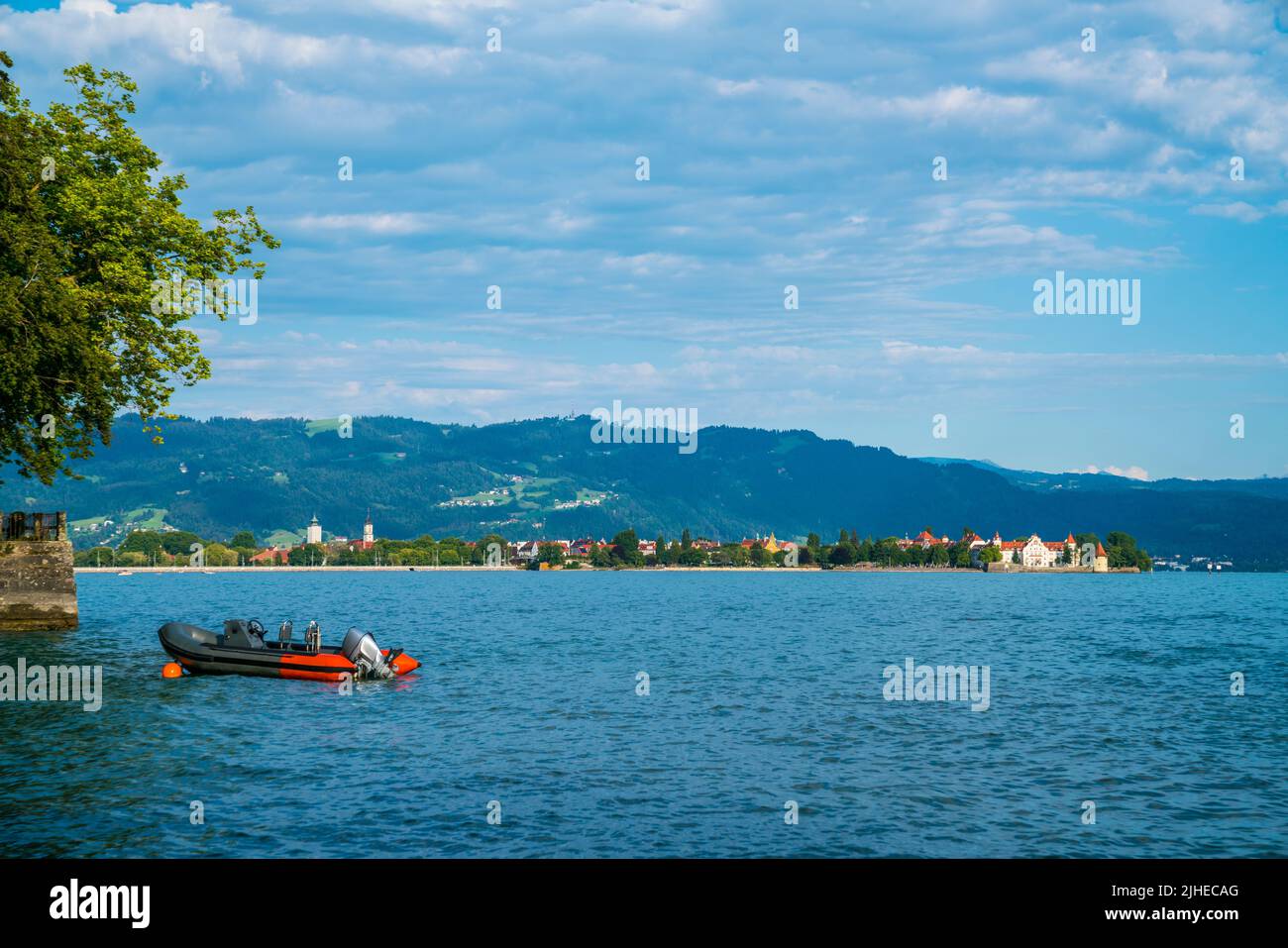 Germany, Lindau city island in warm sunset sunlight from waterside ...