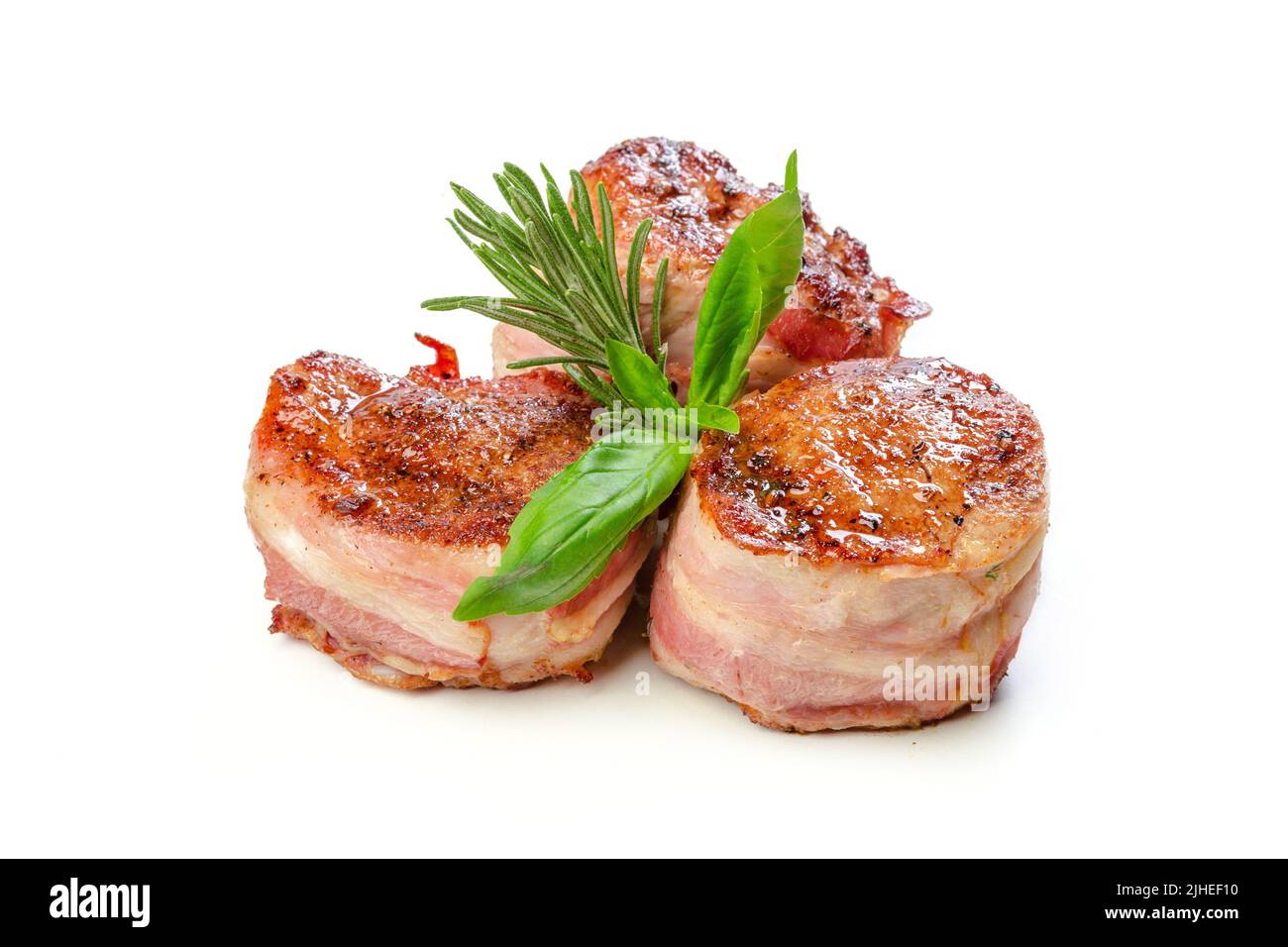 Pork fillet wrapped in bacon, isolated on white background Stock Photo ...