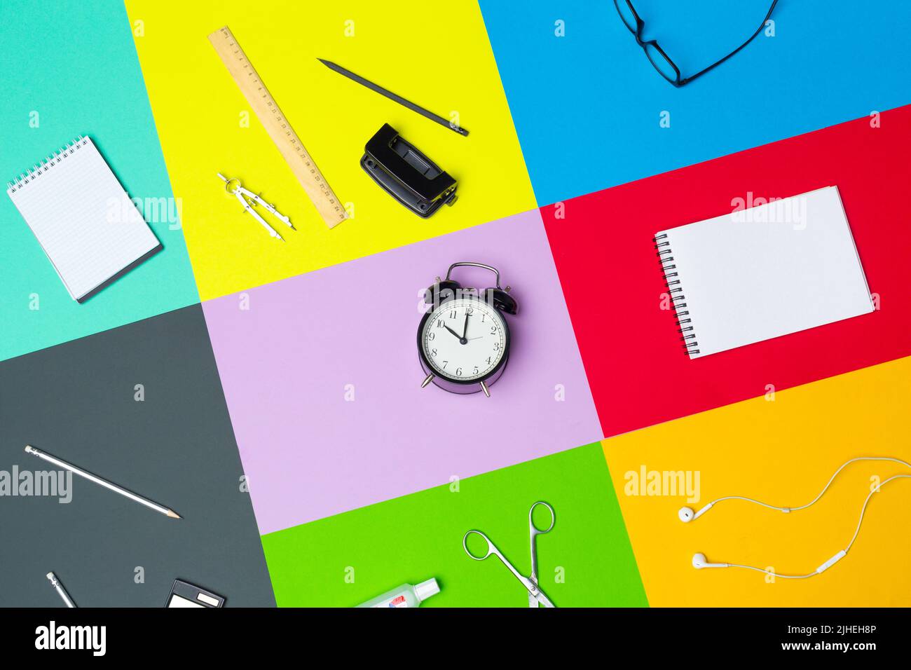 school supplies at colorful paper background Stock Photo - Alamy