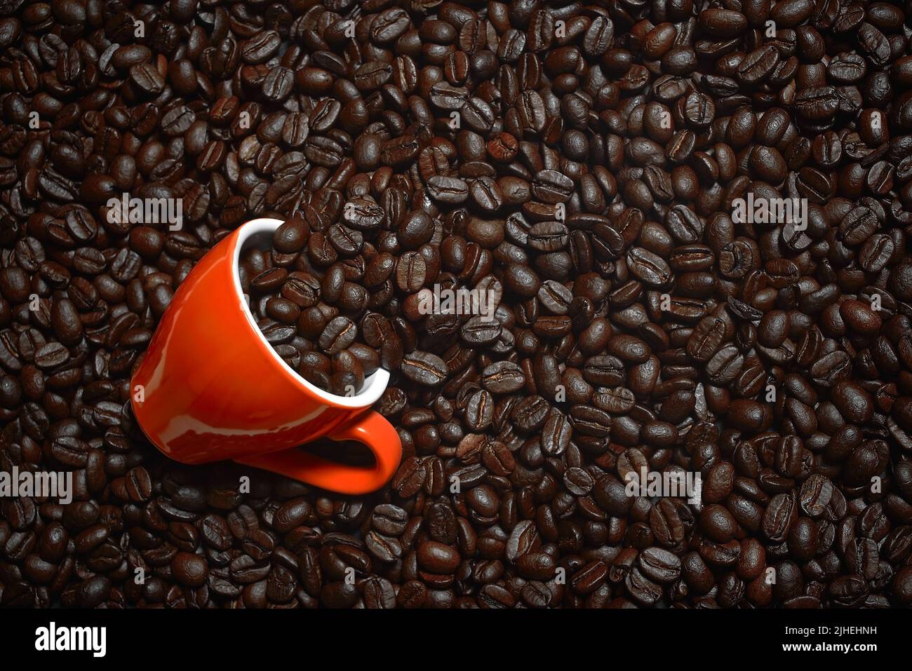 coffee cup laying on coffee beans mockup Stock Photo - Alamy