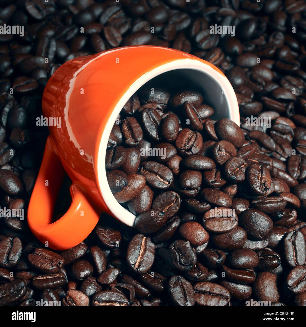 coffee cup laying on coffee beans mockup Stock Photo - Alamy