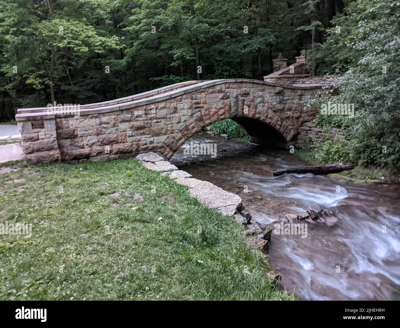 A small stone bridge over the river Stock Photo - Alamy