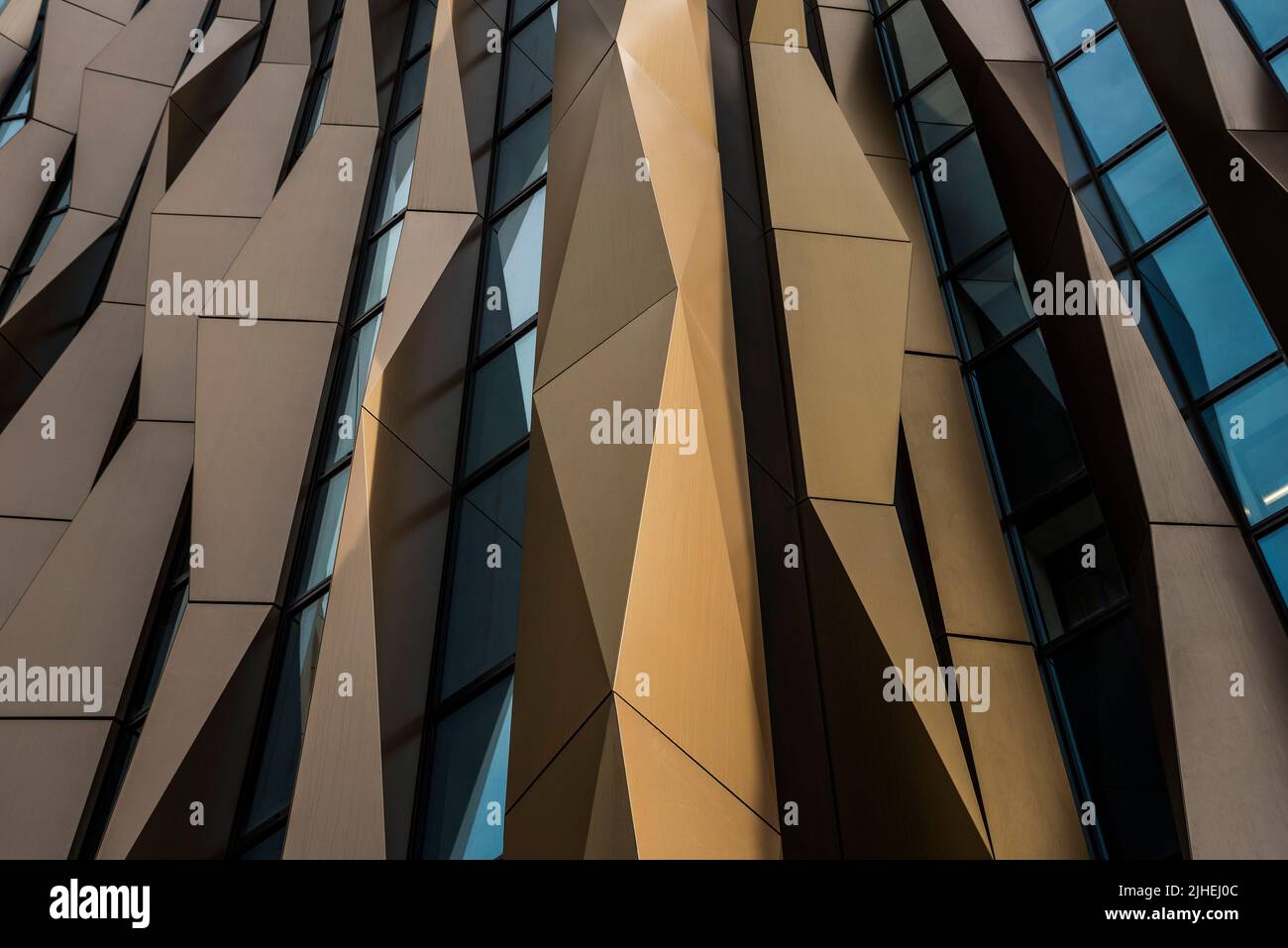 City residential building with crystalline style cladding. Abstract ...
